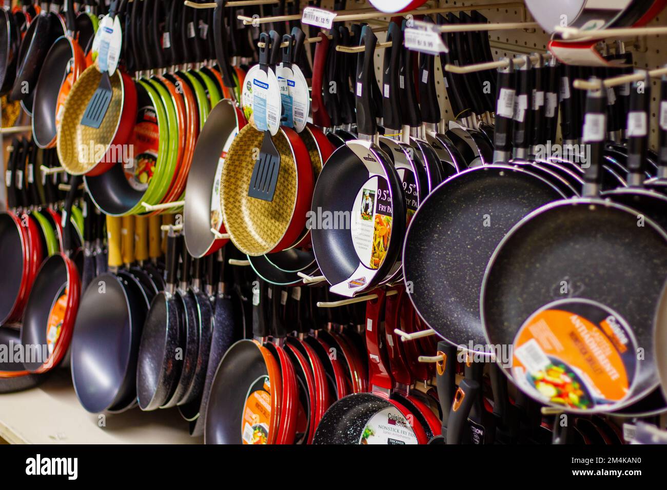 shelf of pans of various types and sizes in store Stock Photo - Alamy