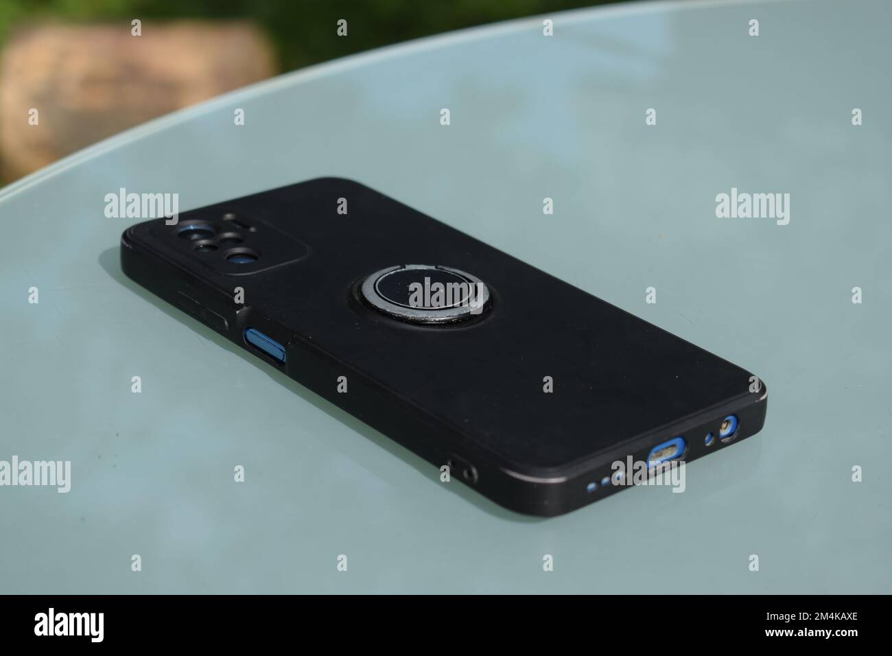 Cool black smartphone on the table screen facing down Stock Photo - Alamy