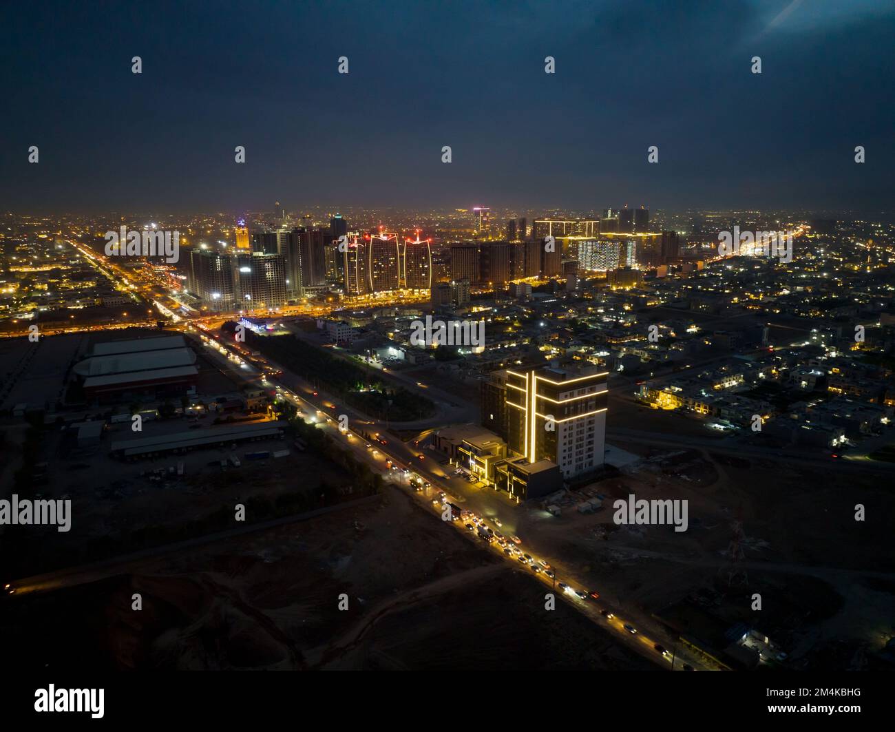 An aerial view of Erbil city with busy streets and illuminated ...