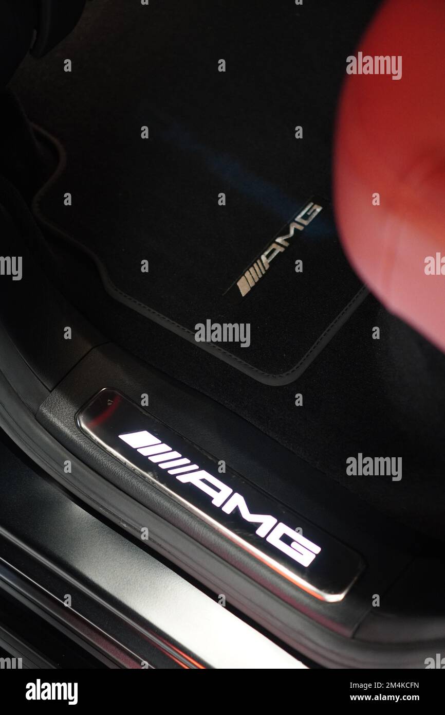 A closeup of Mercedes-Benz AMG backlit door sill and floor mat Stock ...