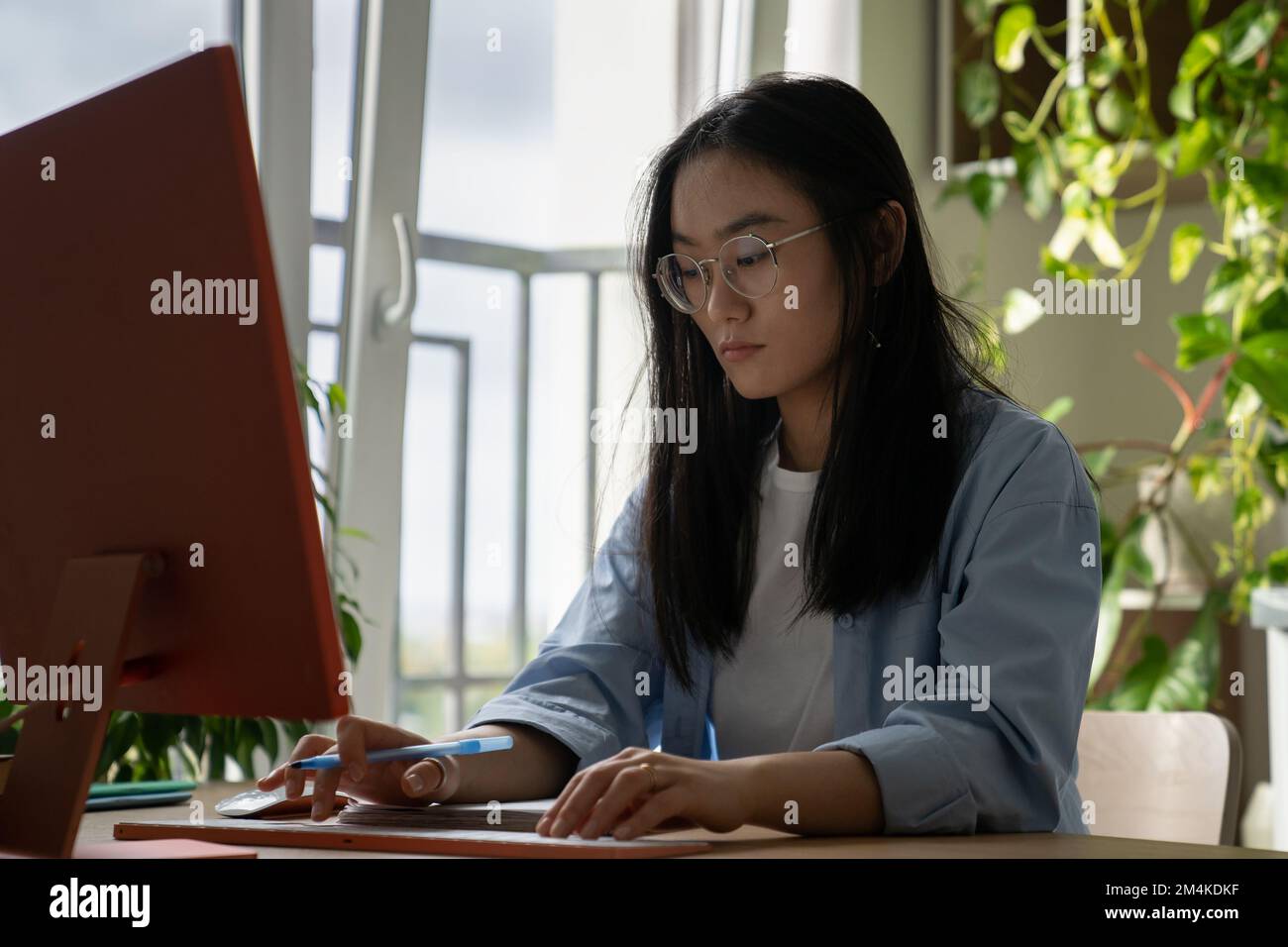 Young Asian woman freelance journalist using computer, writing for ...