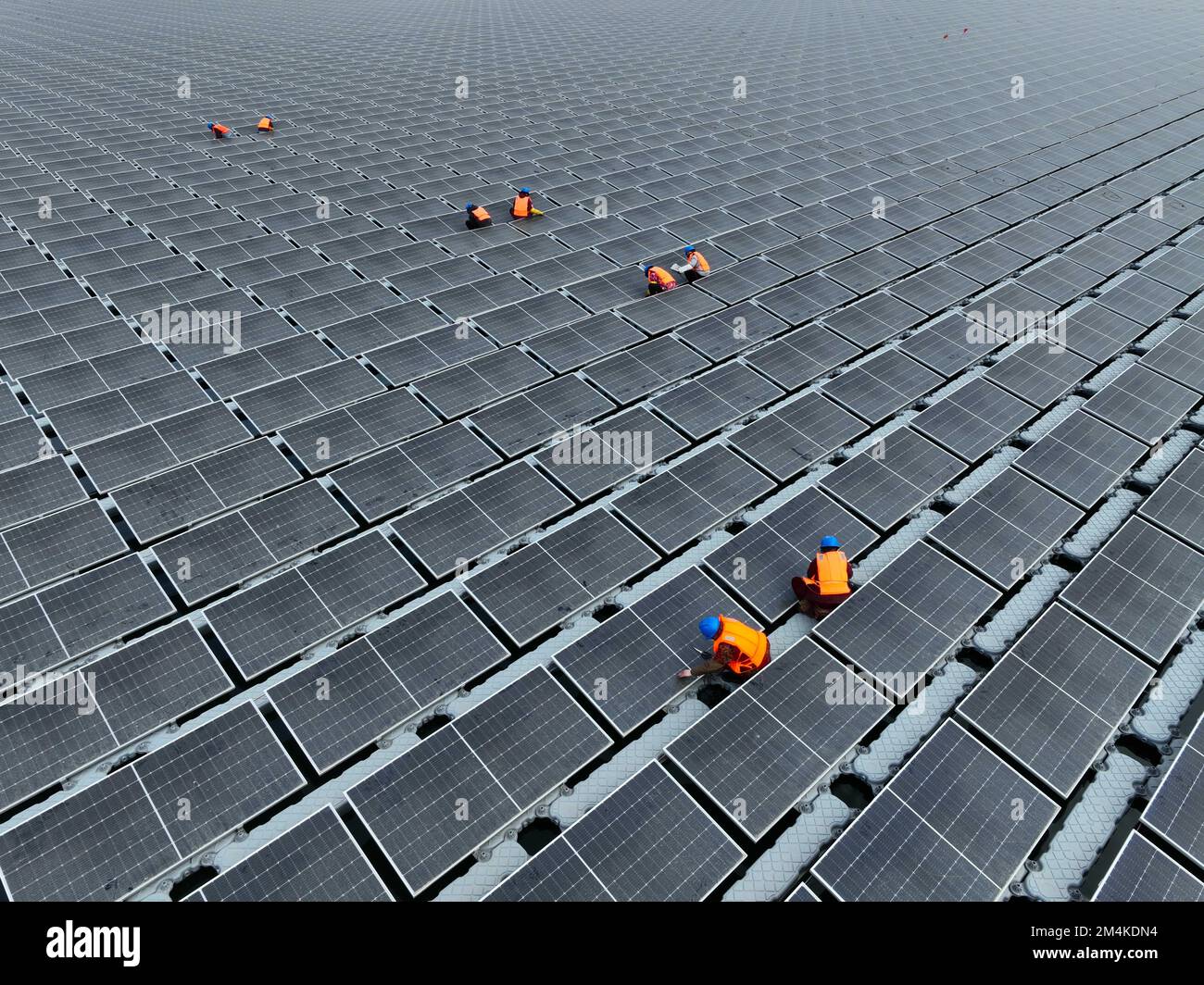 LIAOCHENG, CHINA - DECEMBER 21, 2022 - Workers carry out the final ...