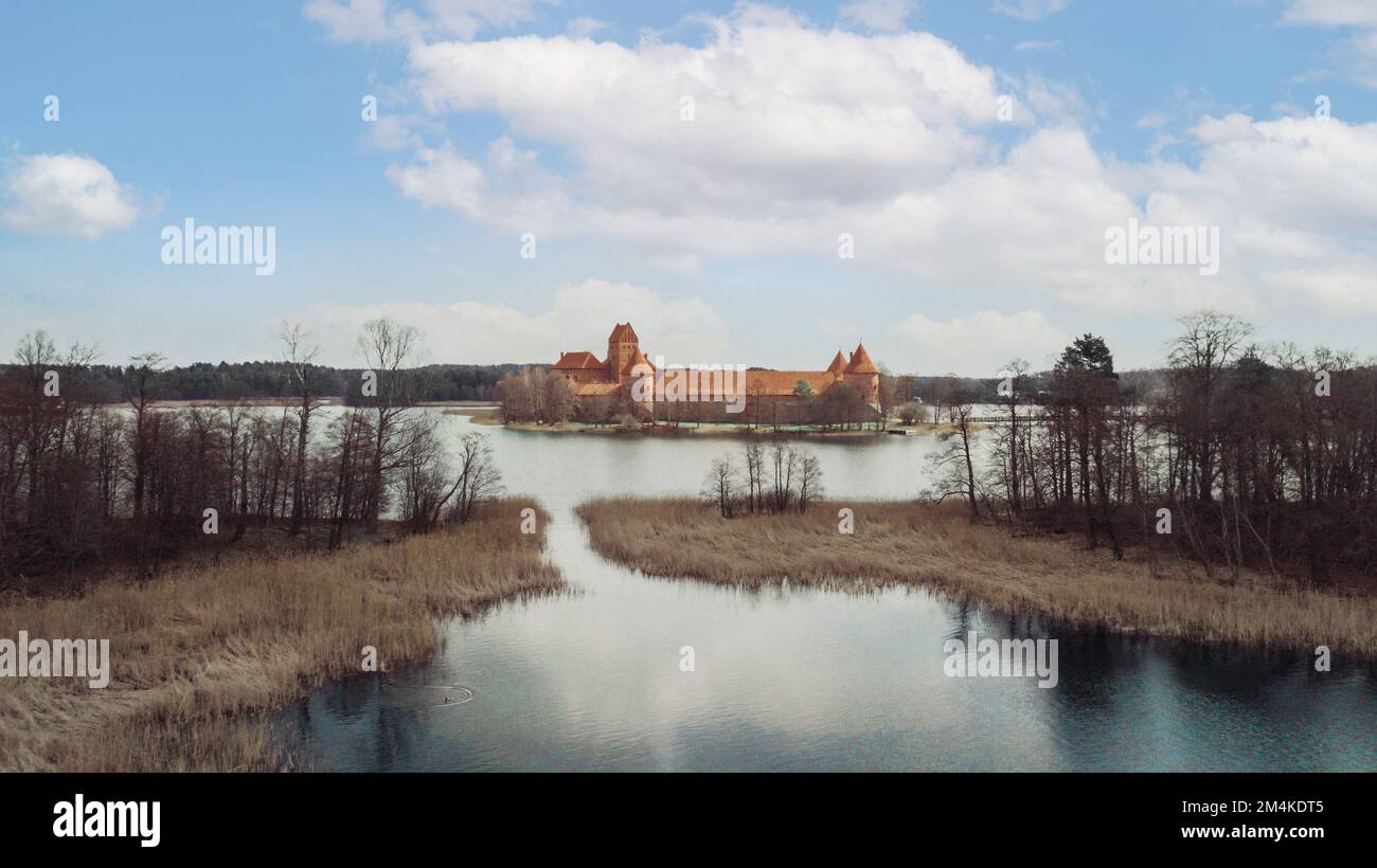 The Trakai Island Castle in Lithuania surrounded by the lake against ...