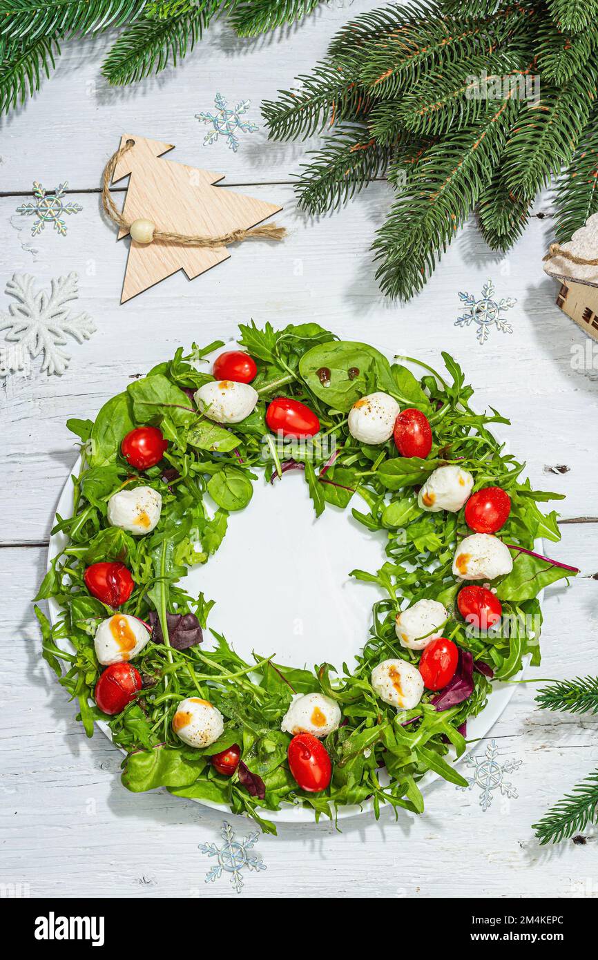 Charcuterie wreath with Christmas decorations. Fashionable snack ...