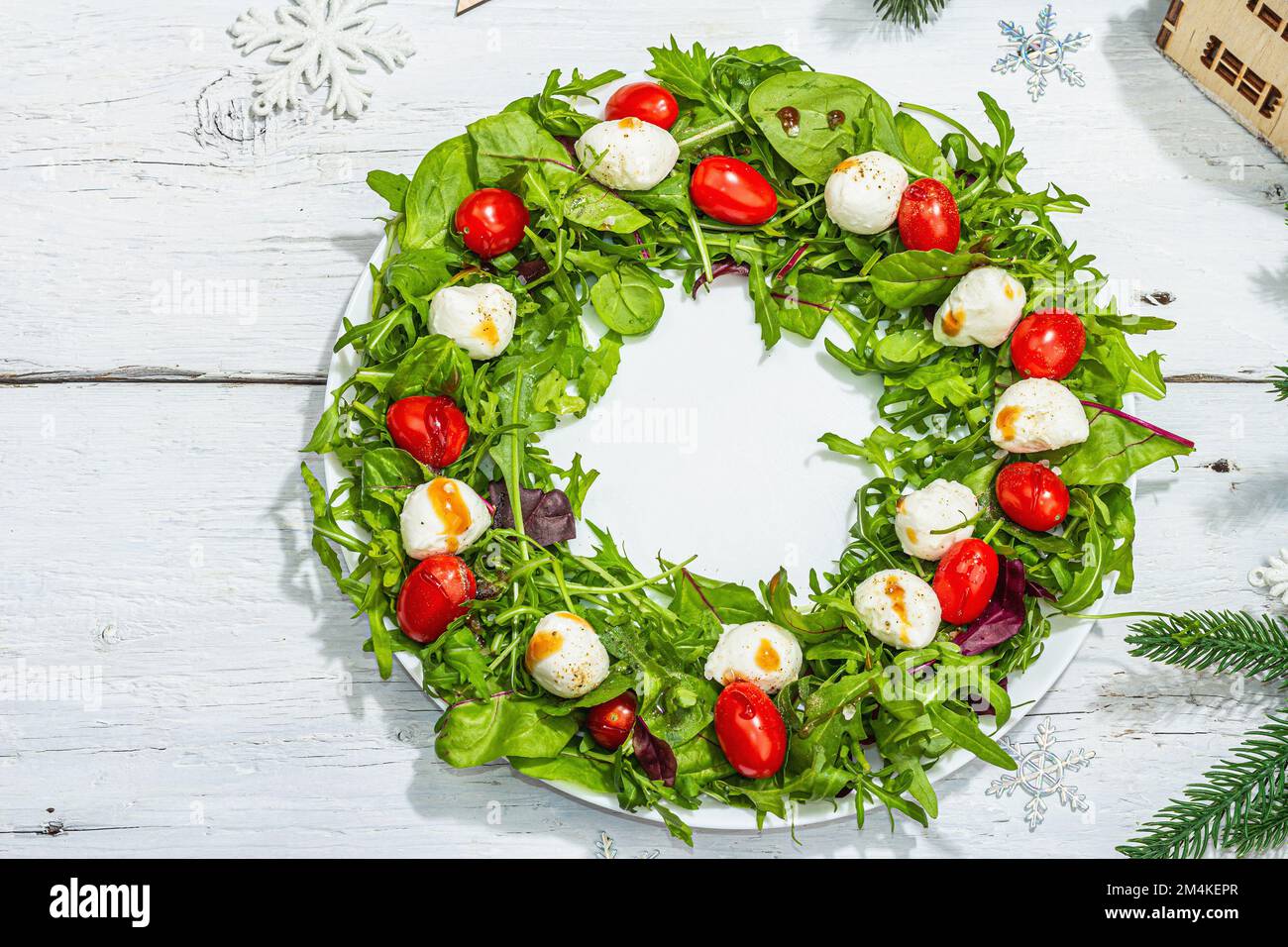 Charcuterie wreath with Christmas decorations. Fashionable snack ...