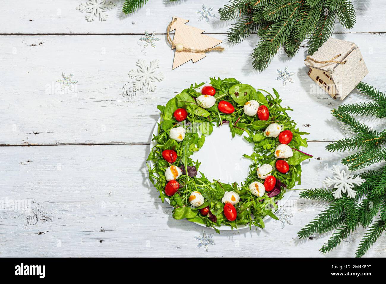 Charcuterie wreath with Christmas decorations. Fashionable snack ...