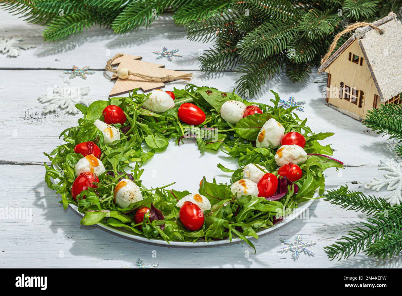 Charcuterie wreath with Christmas decorations. Fashionable snack ...