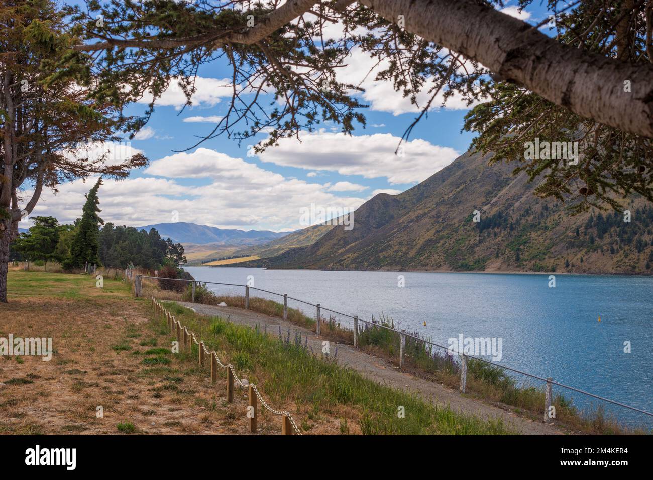 A scenery of a walkway next to the Lake Waitaki near Kurow with a ...