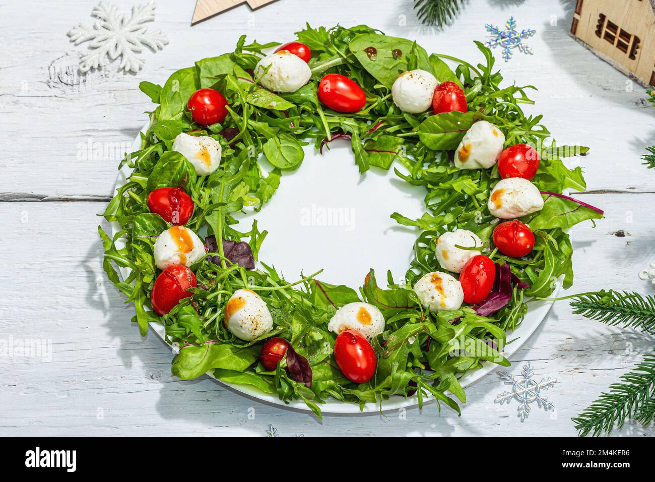 Charcuterie wreath with Christmas decorations. Fashionable snack ...