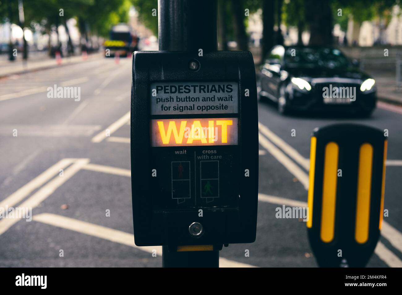 A traffic light near Westminster Bridge in London with a mix of yellow ...