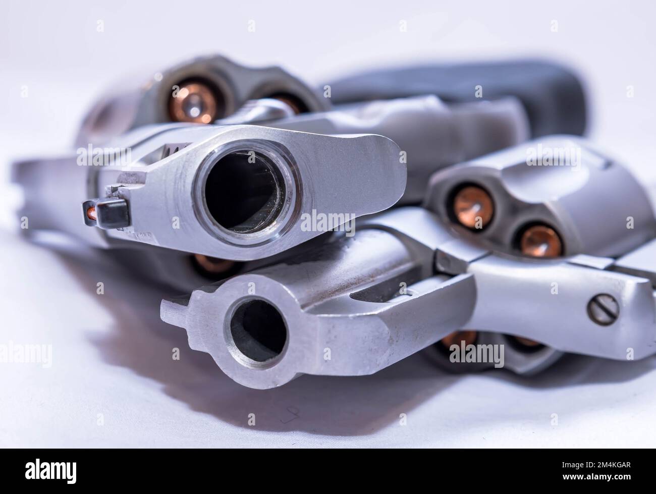 Two stainless snub nose revolvers, a 357 magnum and a 454 casull loaded ...