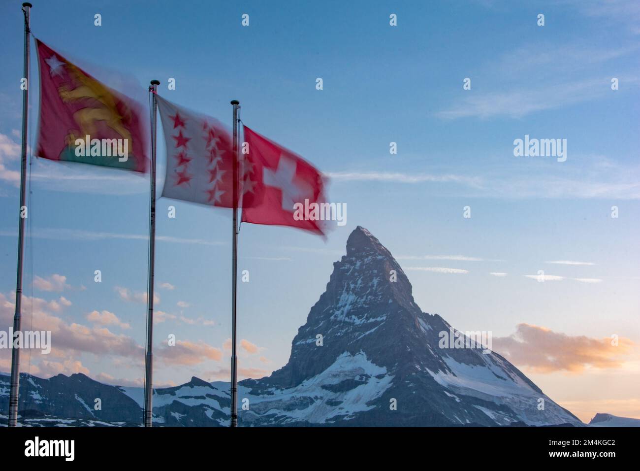 The three flags near Matterhorn mountains, at Swiss Alps, Valais ...