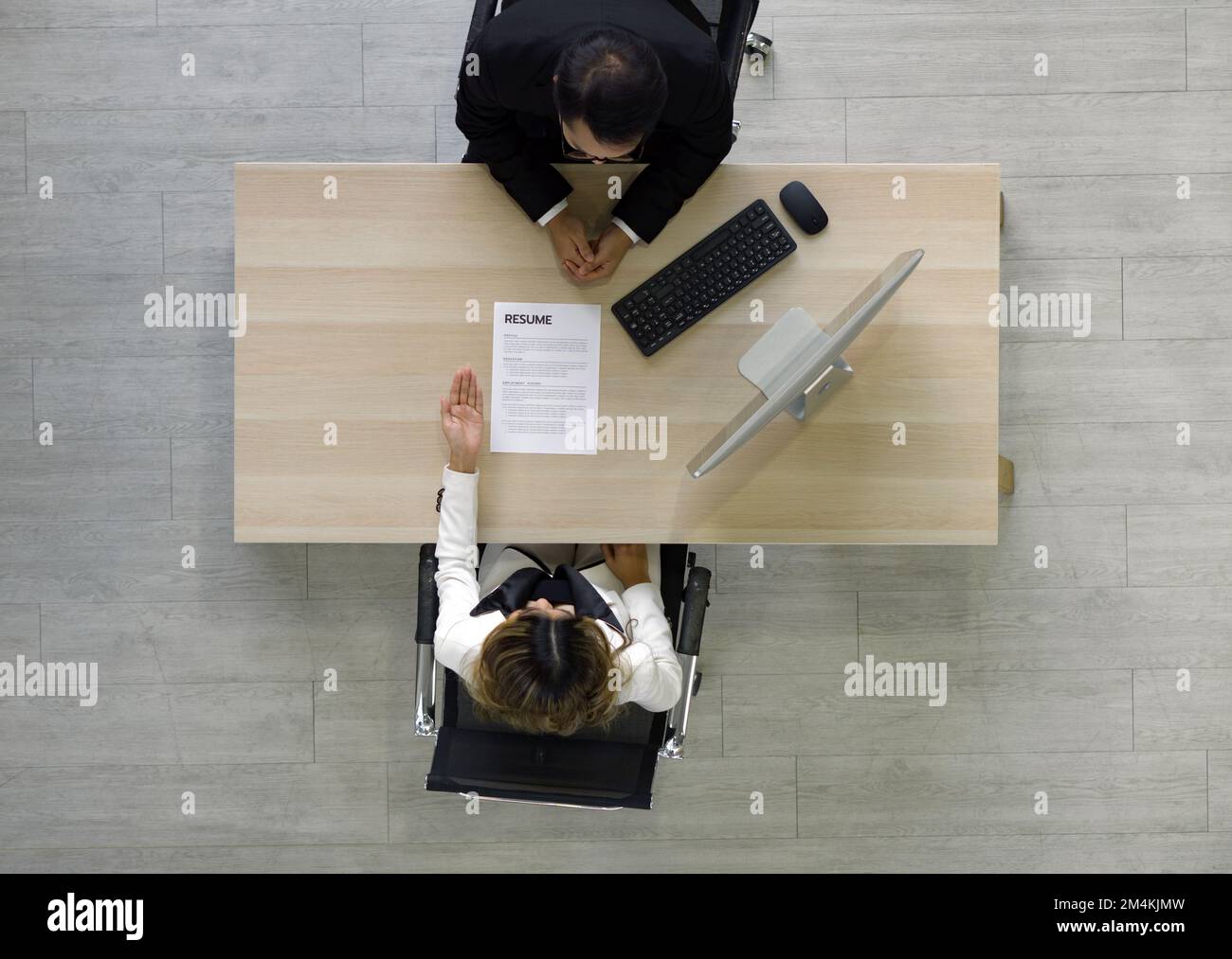 Young asian candidate offer resume to Human Resource Manager in black ...