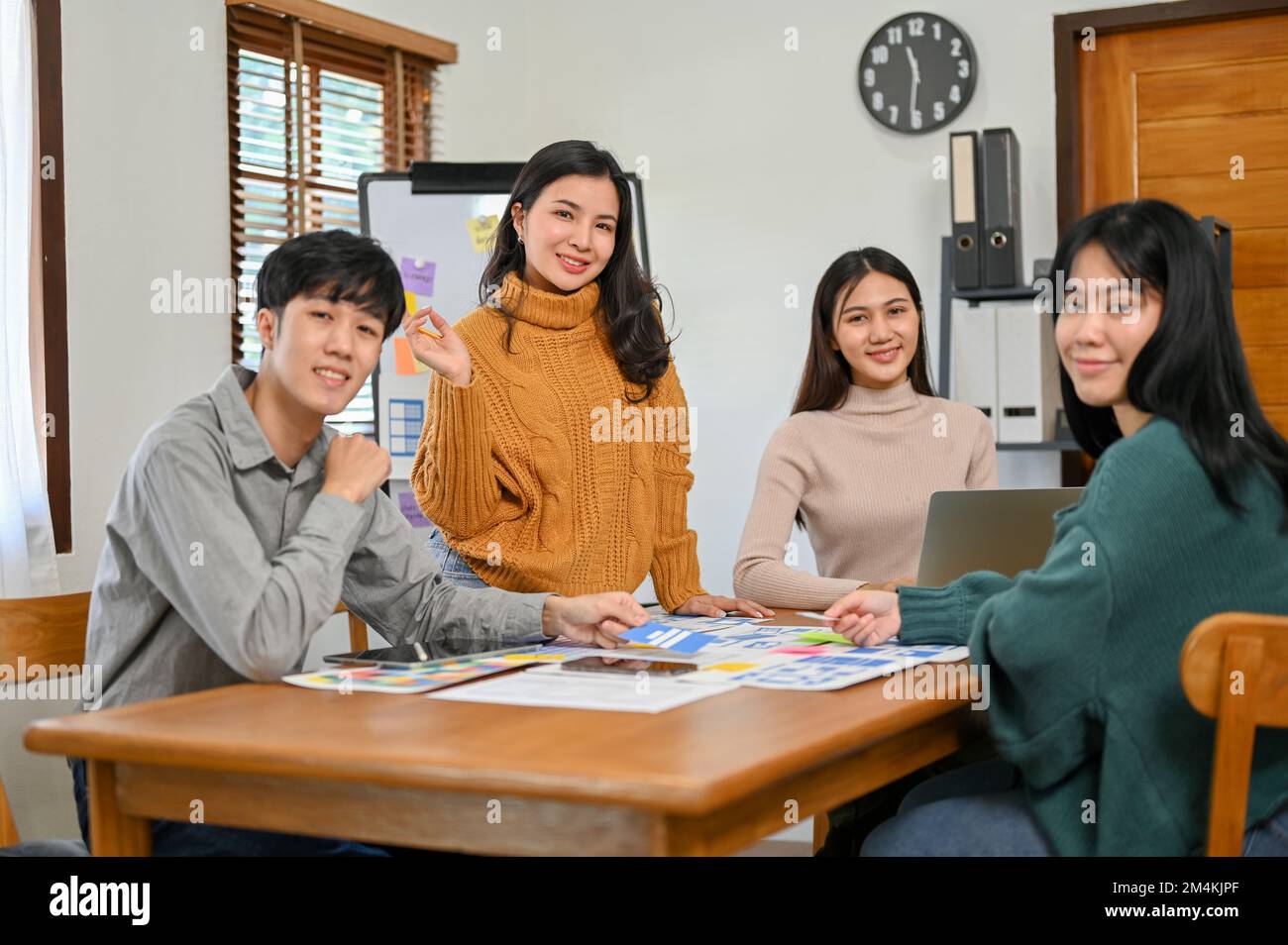 Team of millennials Asian mobile application developers and designers ...