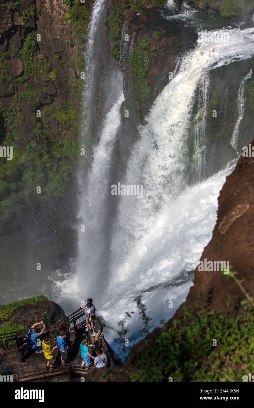 Tourists stand on a viewing platform adjacent to one of the many ...
