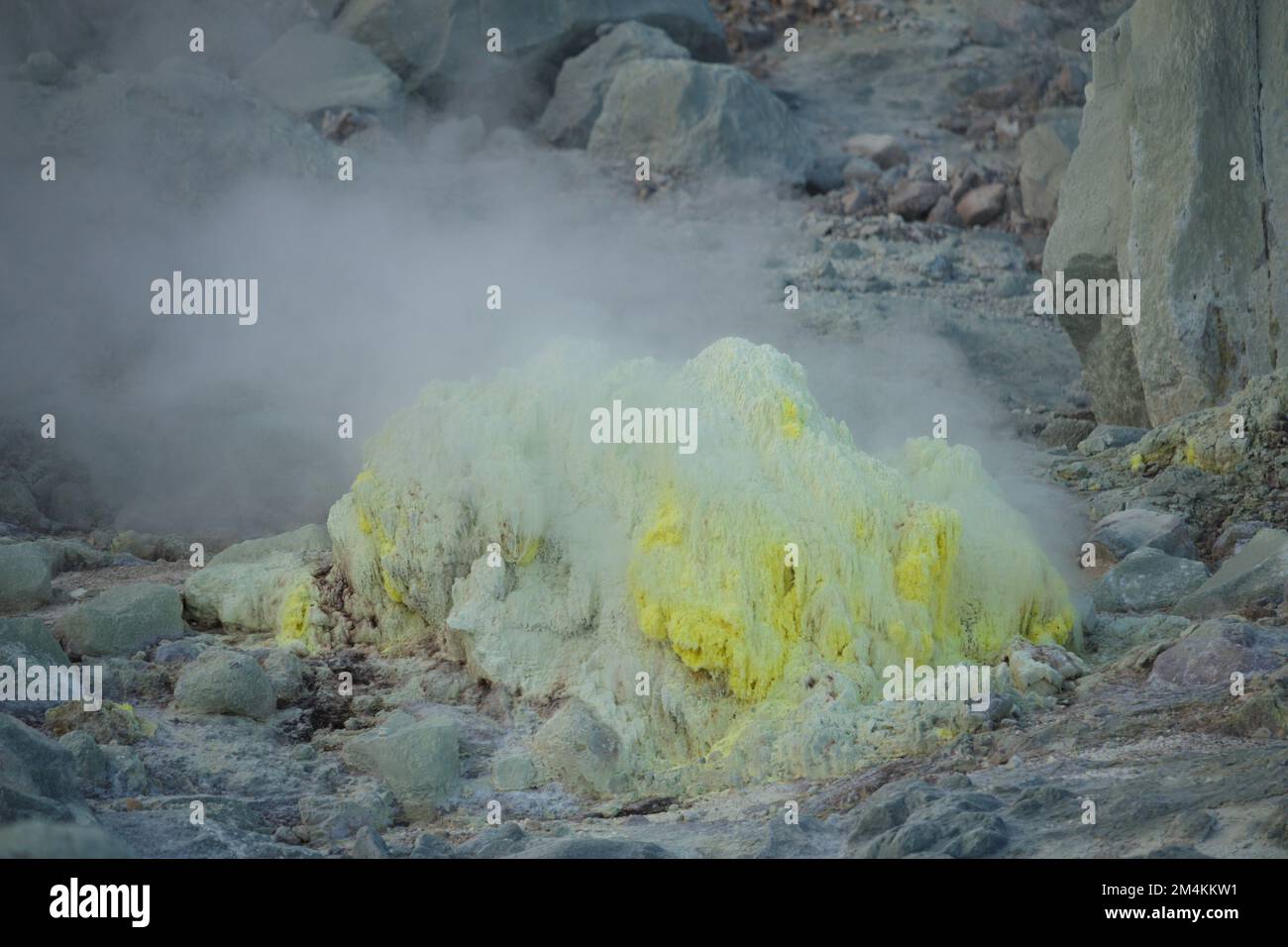 Yellow sulphur crystals and steam on volcano Stock Photo - Alamy