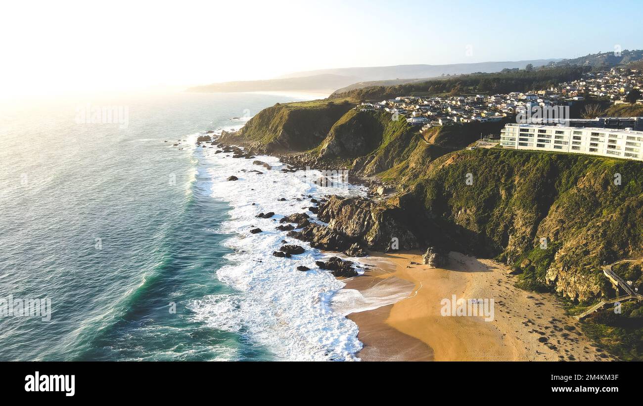 An aerial view of a sandy coast with rocks in Algarrobo, Valparaiso ...