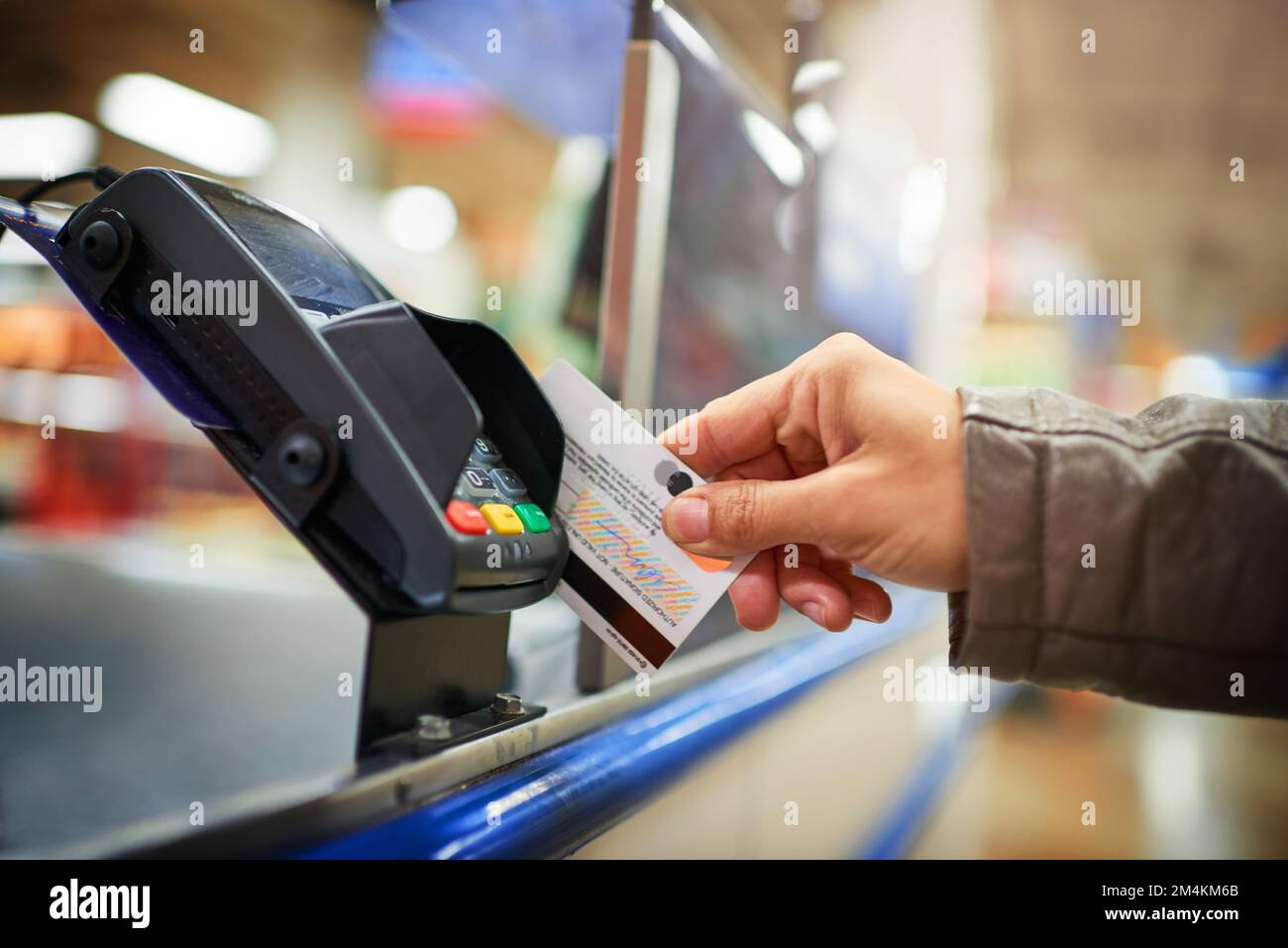 She gets points every time she swipes. an unrecognizable woman making ...