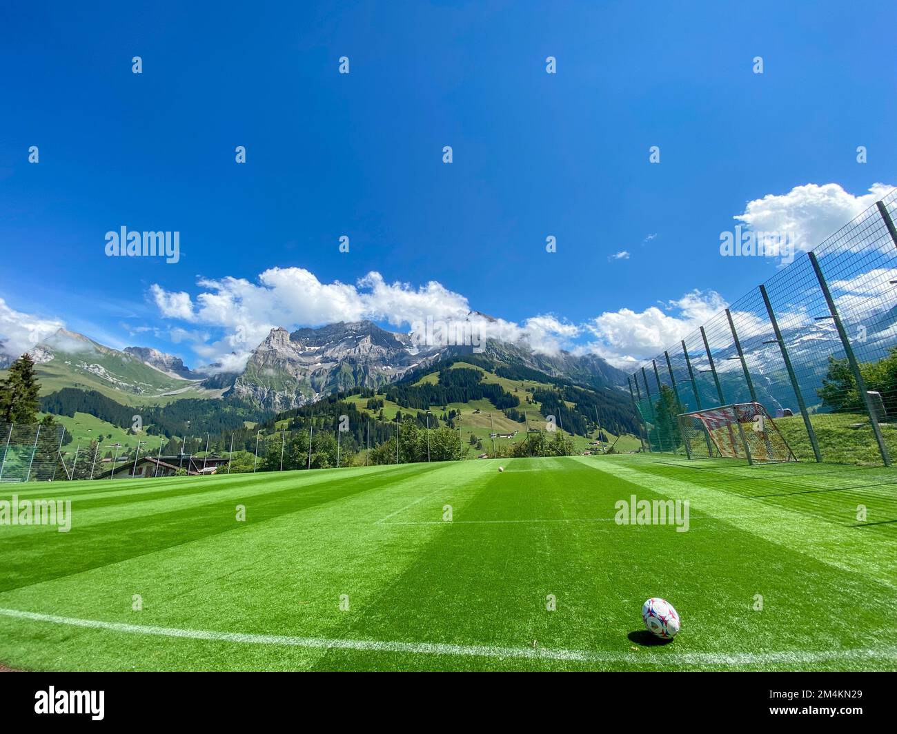 The soccer field with mountains in the background in Adelboden village ...