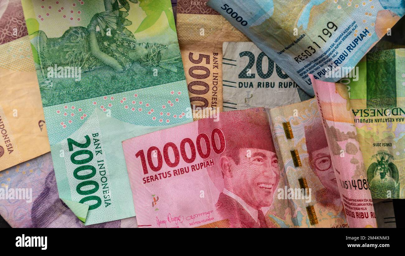 pile of rupiah banknotes as background Stock Photo - Alamy