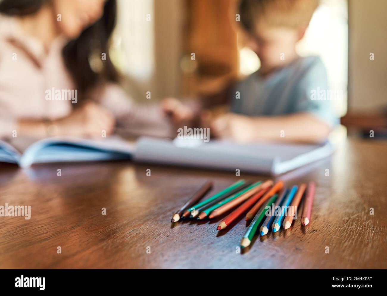 Kids doing homework table hi-res stock photography and images - Alamy