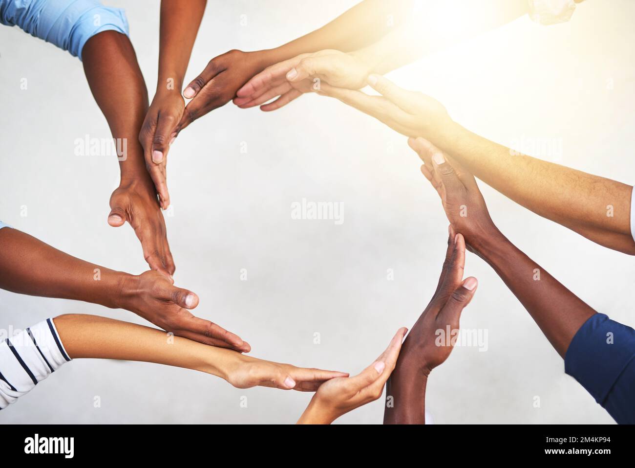 The circle of trust. a group of businesspeople joining their hands in ...