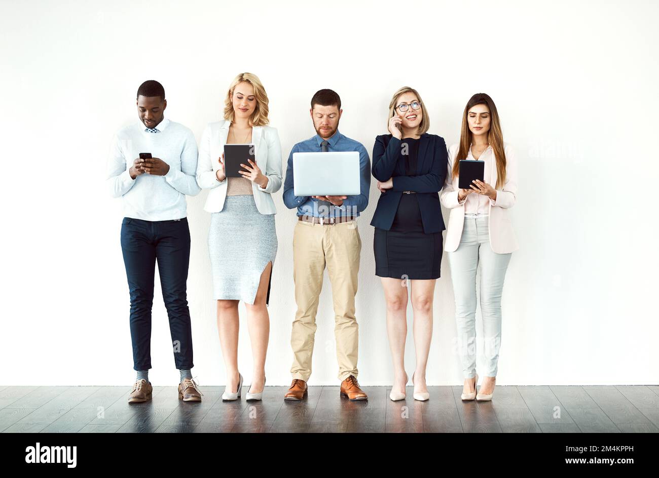 Concentrating is part of what they do. a group of work colleagues ...