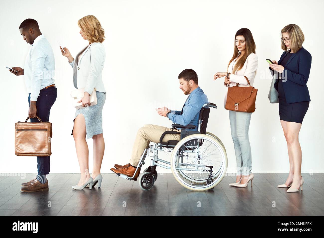 They are all patient people. Studio shot of a group o focused people ...