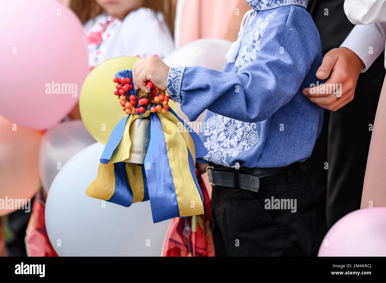 school traditional metal bell in yellow and blue ribbons, Ukrainian ...