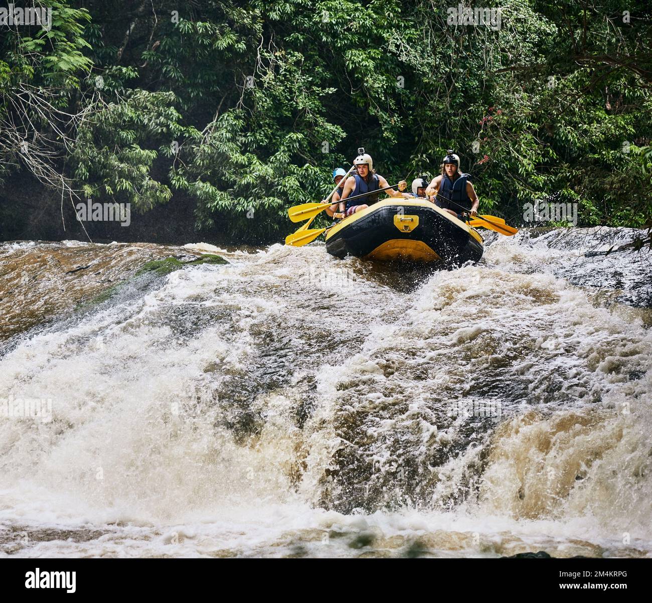 Get ready. a group of determined young men on a rubber boat busy ...
