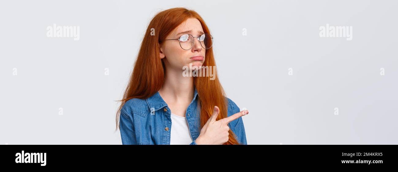 Close-up portrait gloomy and sad pouting cute redhead girl with lovely ...