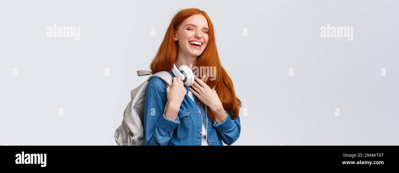 Charismatic and cheerful, lovely friendly redhead girl laughing over ...