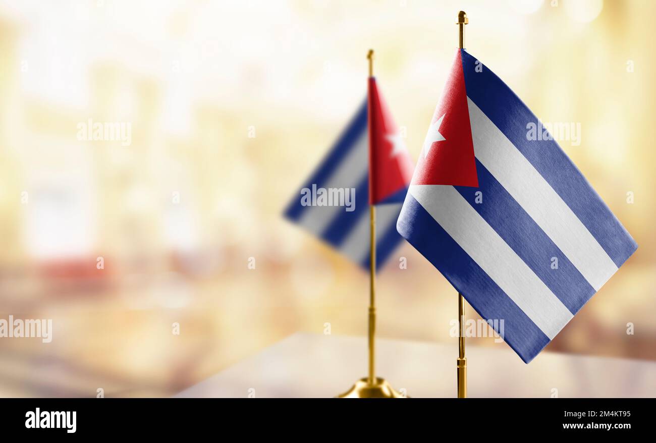 Small flags of the Cuba on an abstract blurry background Stock Photo ...