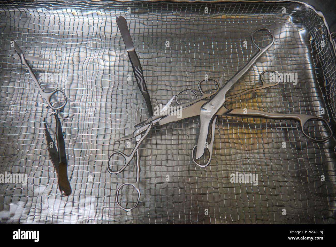 various surgical instruments are cleaned in an ultrasonic bath Stock ...