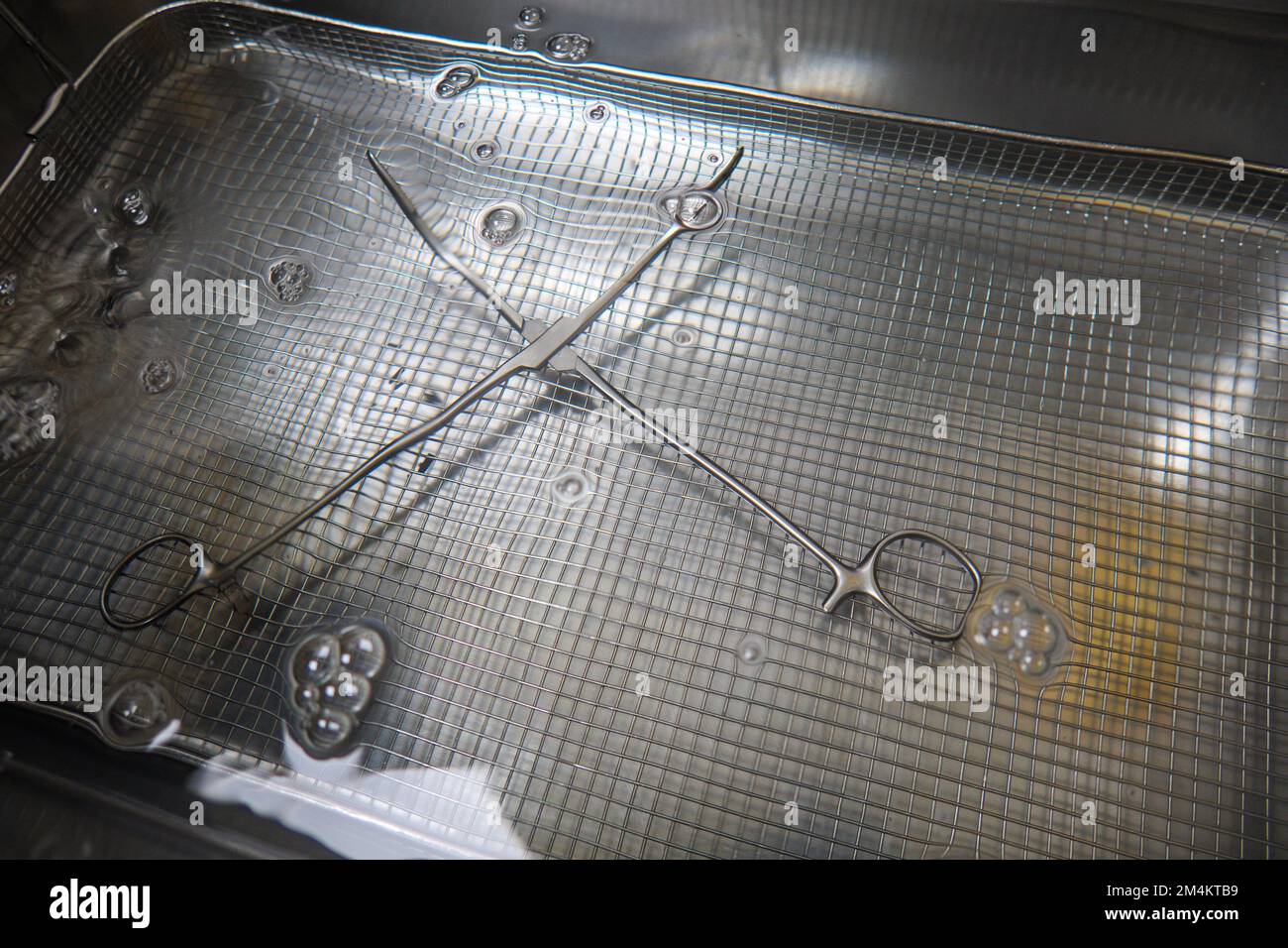 a surgical instrument is placed in an ultrasonic bath Stock Photo - Alamy