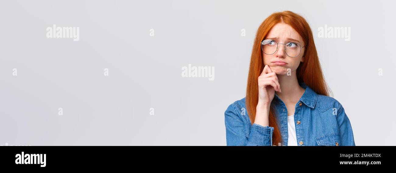 Uneasy sulky cute timid redhead college girl in glasses, look up ...