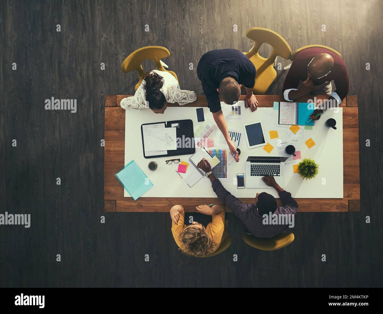 Meetings, an integral part of business operations. High angle shot of a ...