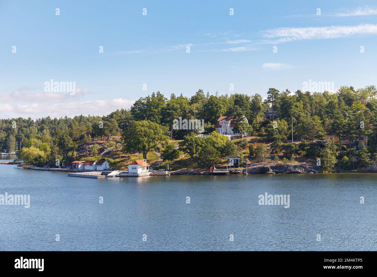 Stockholm Archipelago, view from the cruise ship. Cottages on the shore ...