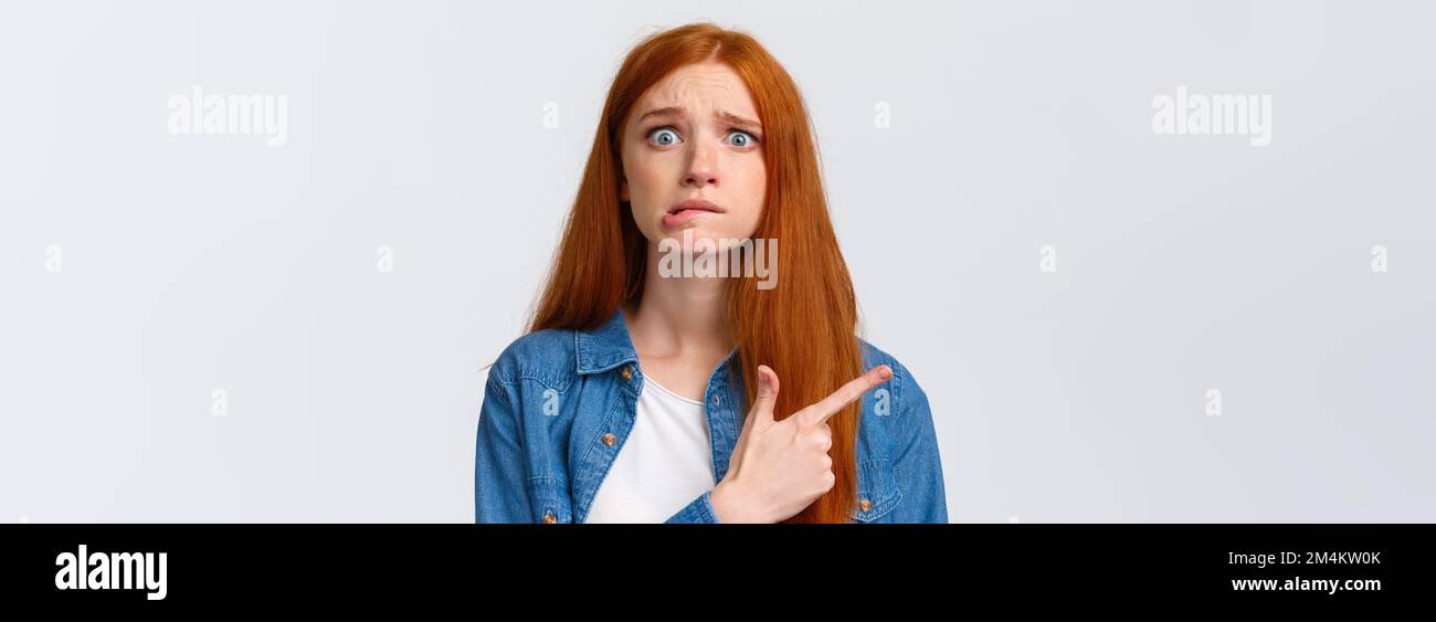 Anxious and worried concerned redhead caucasian girl having big ...