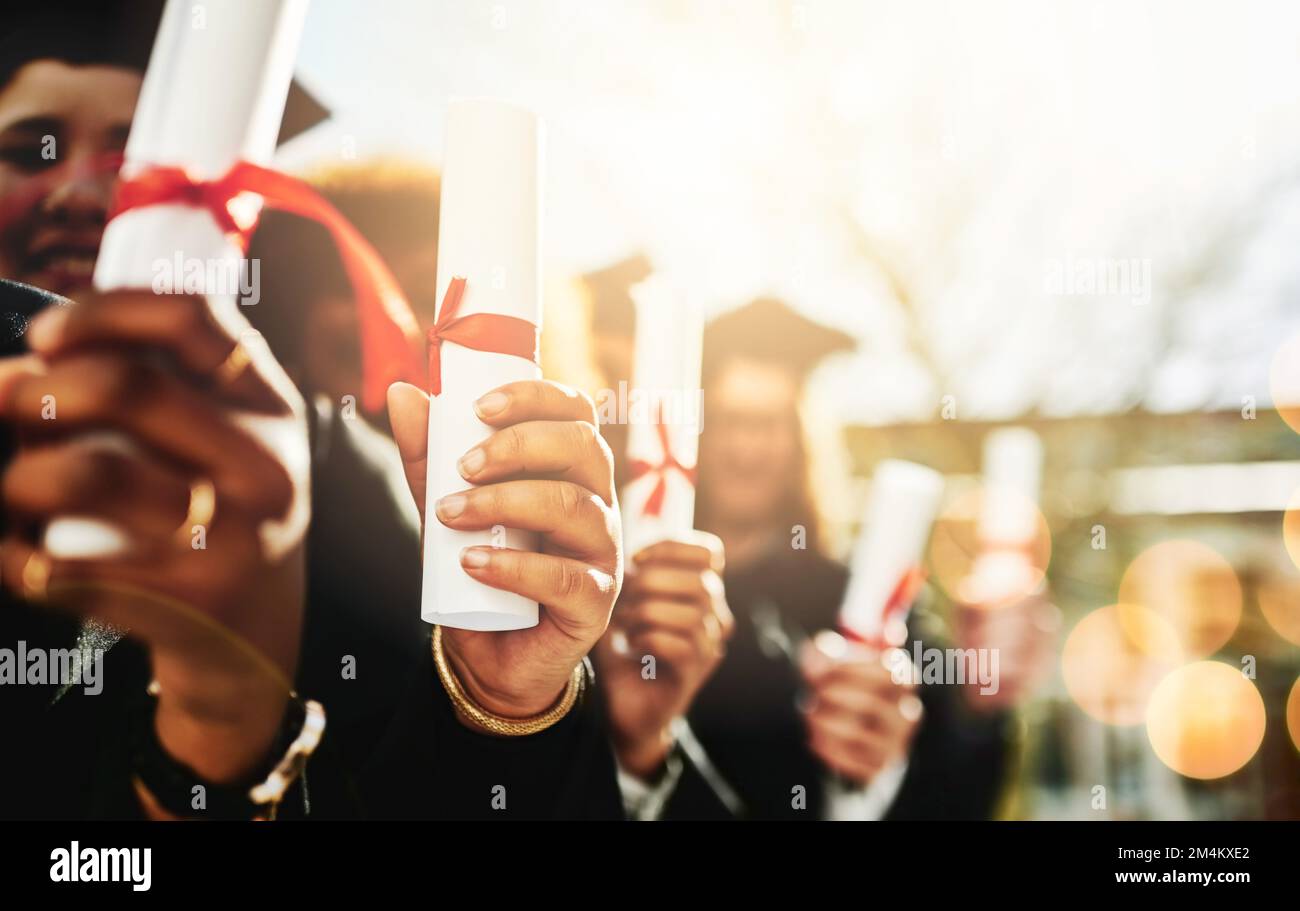 We have bragging rights. a group of students holding their diplomas on ...