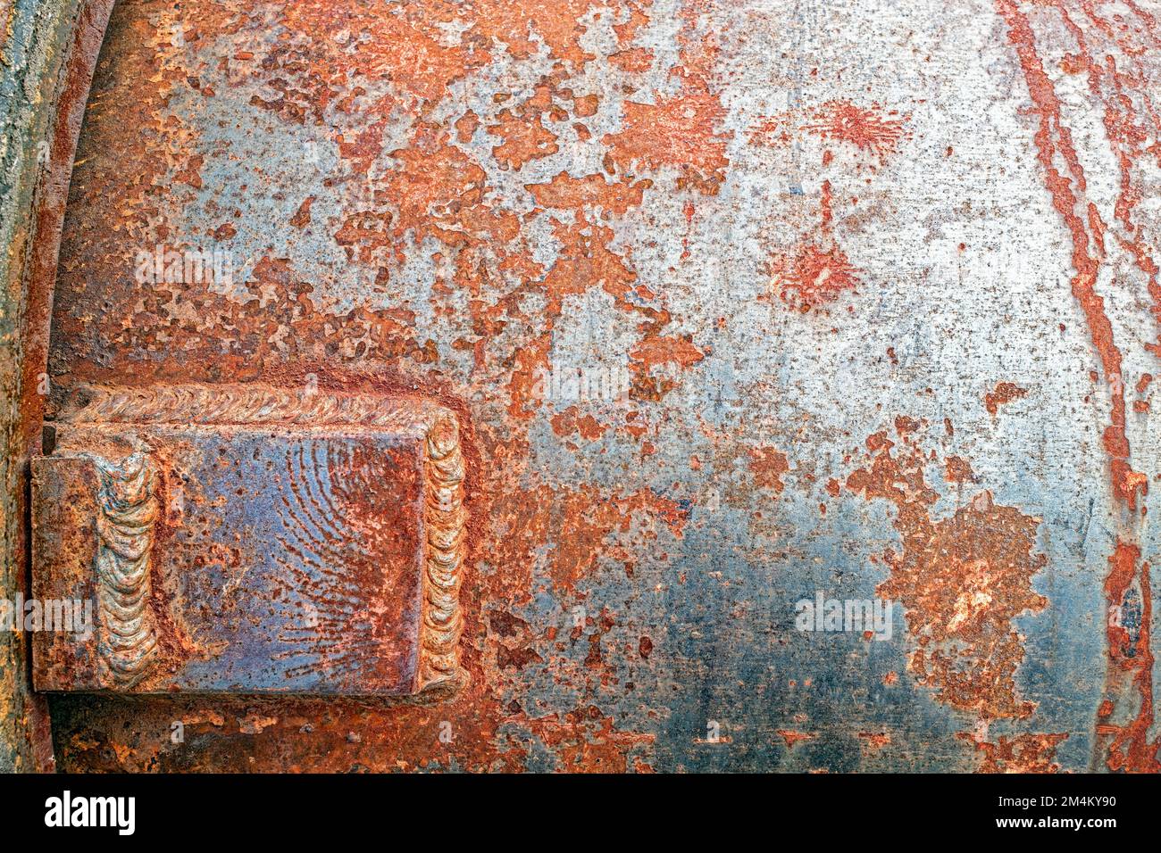 The welds on the rusty surface of a metal pipe at an abandoned mercury ...