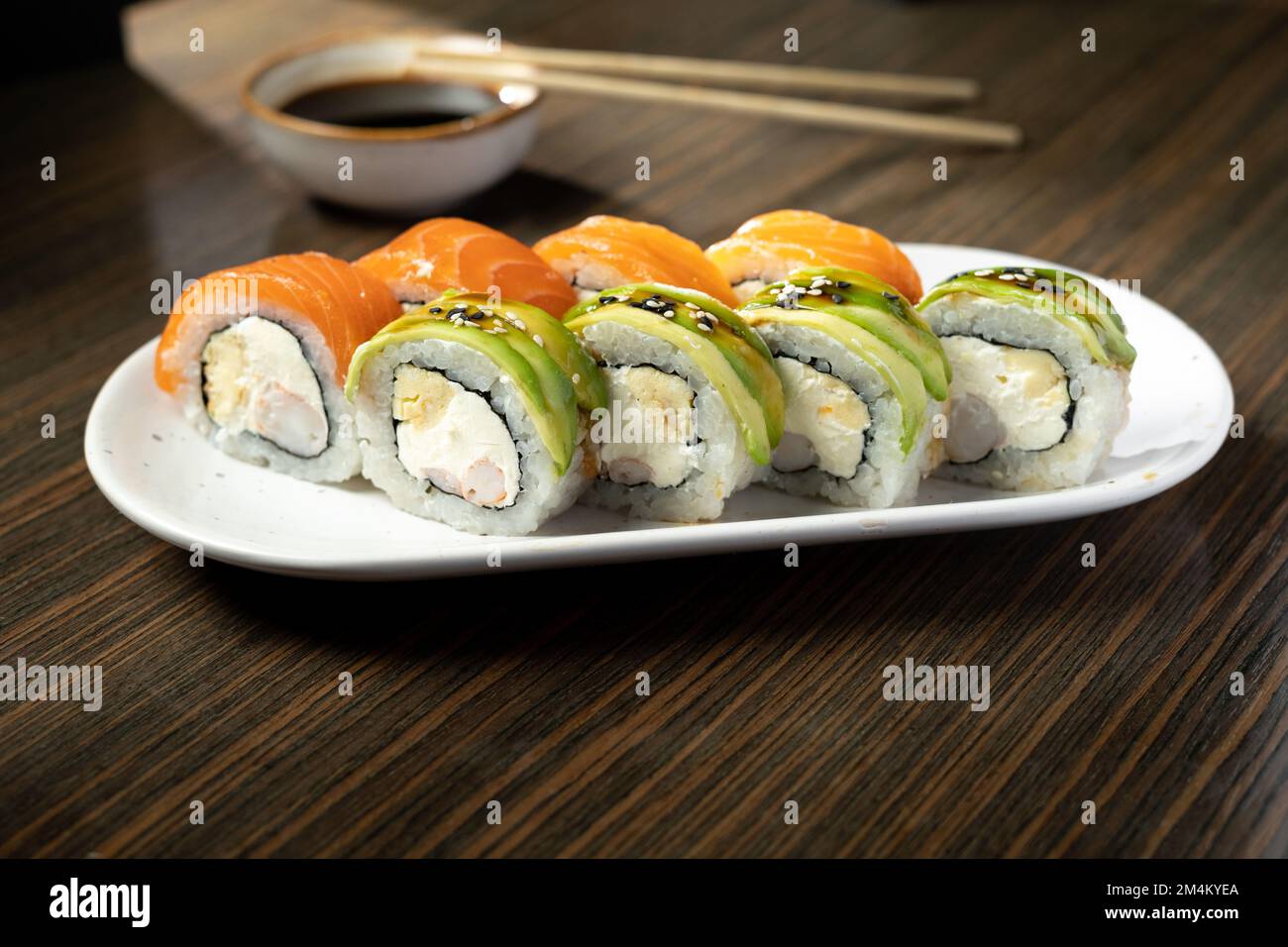 Philadelphia sushi roll with salmon, prawn, avocado, cream cheese ...