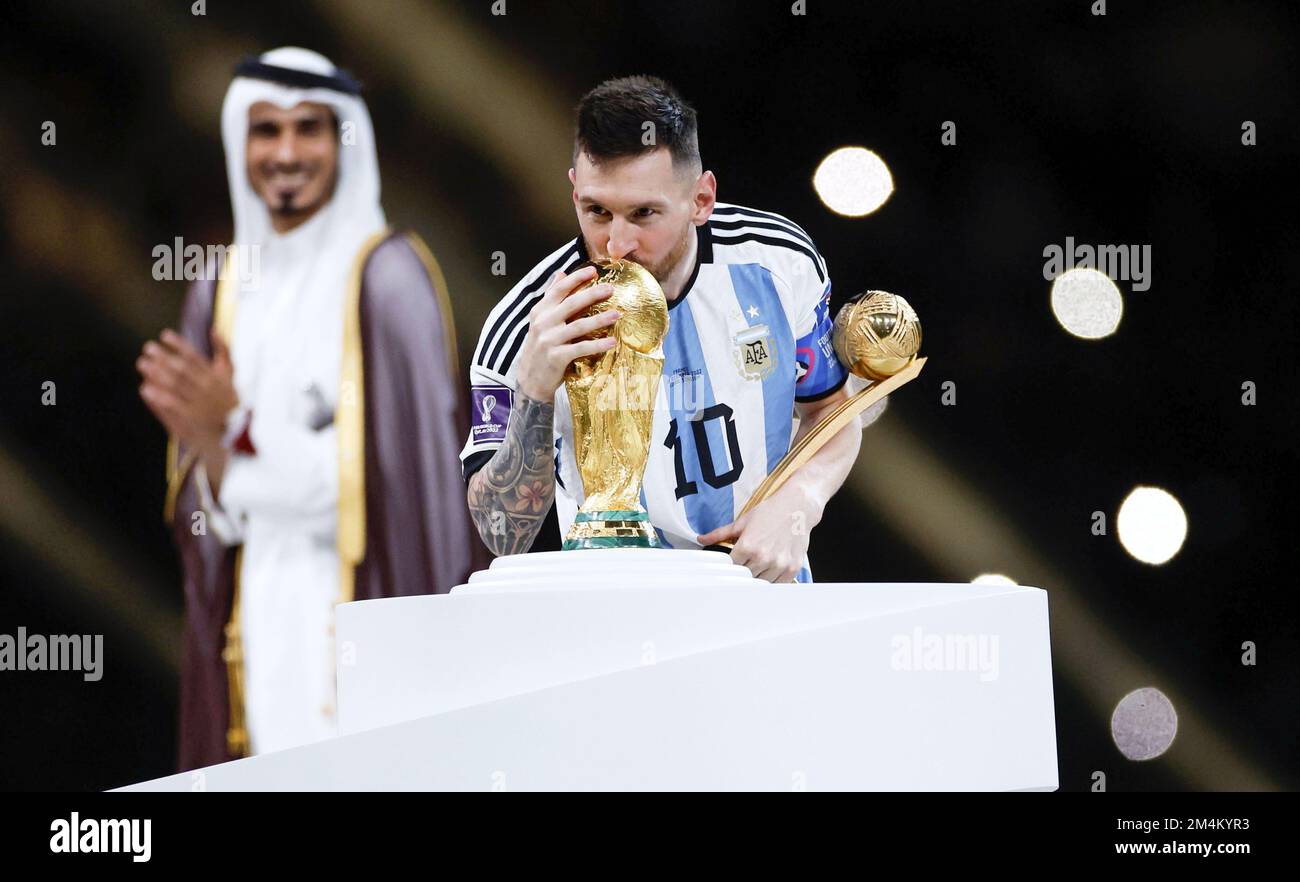 Argentina's Lionel Messi kisses the football World Cup trophy after his ...