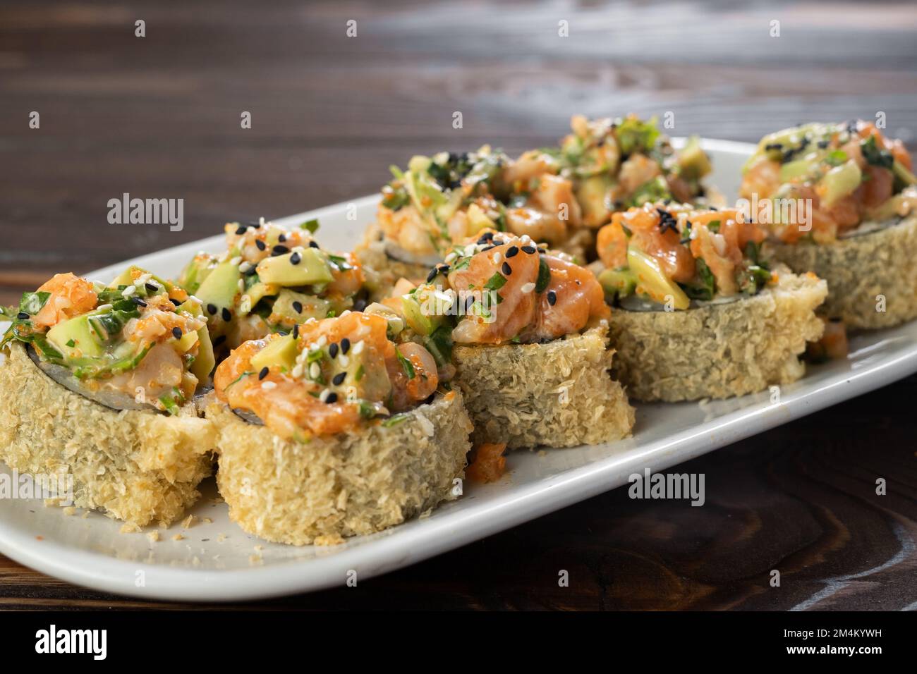 Japanese cuisine tempura sushi rolls made of salmon, eel and crab meat ...