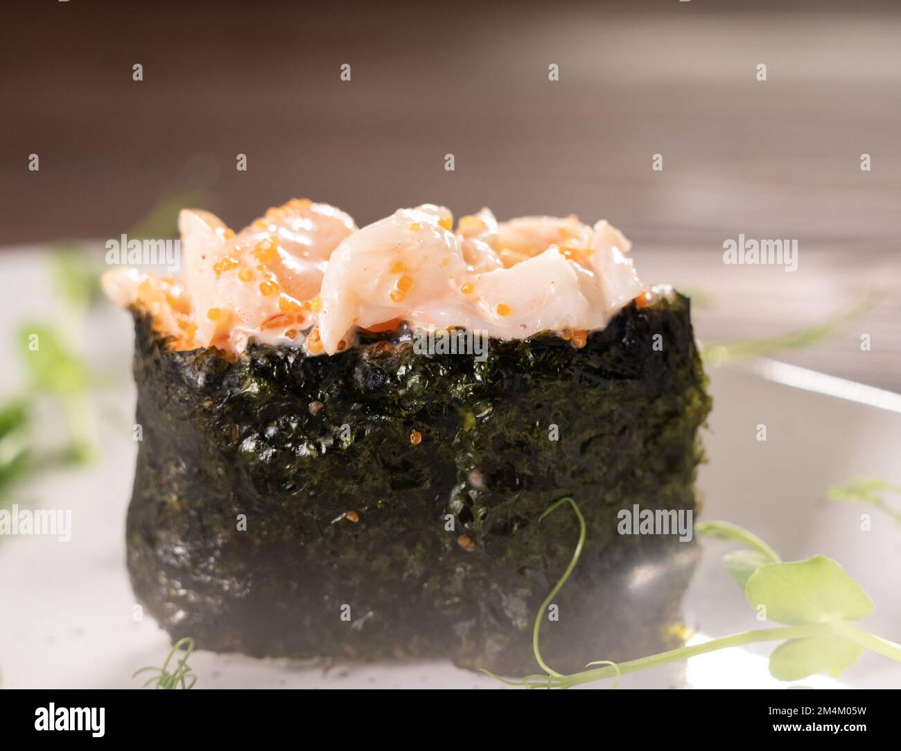 Gunkan sushi from tobiko flying fish roe in plate. Japanese Cuisine. Close up Stock Photo - Alamy