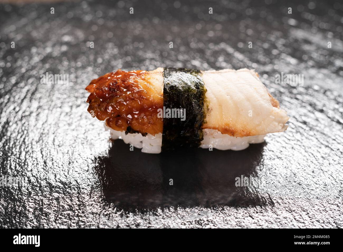 Delicious unagi eel nigiri sushi on black background. Eel Sushi. Traditional Japanese cuisine ...
