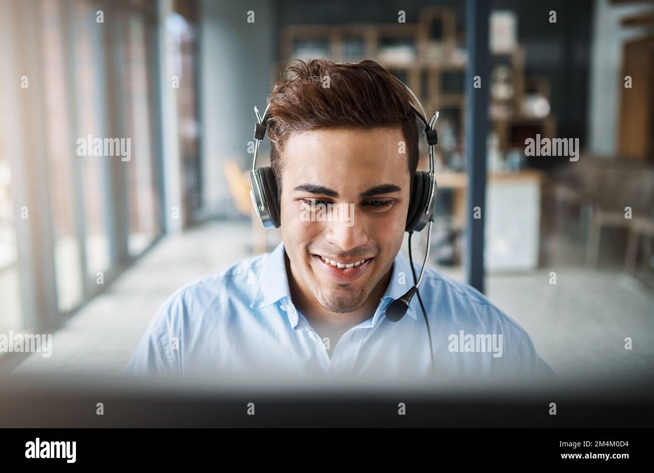 Always pleasant and professional. a handsome young man working in a ...