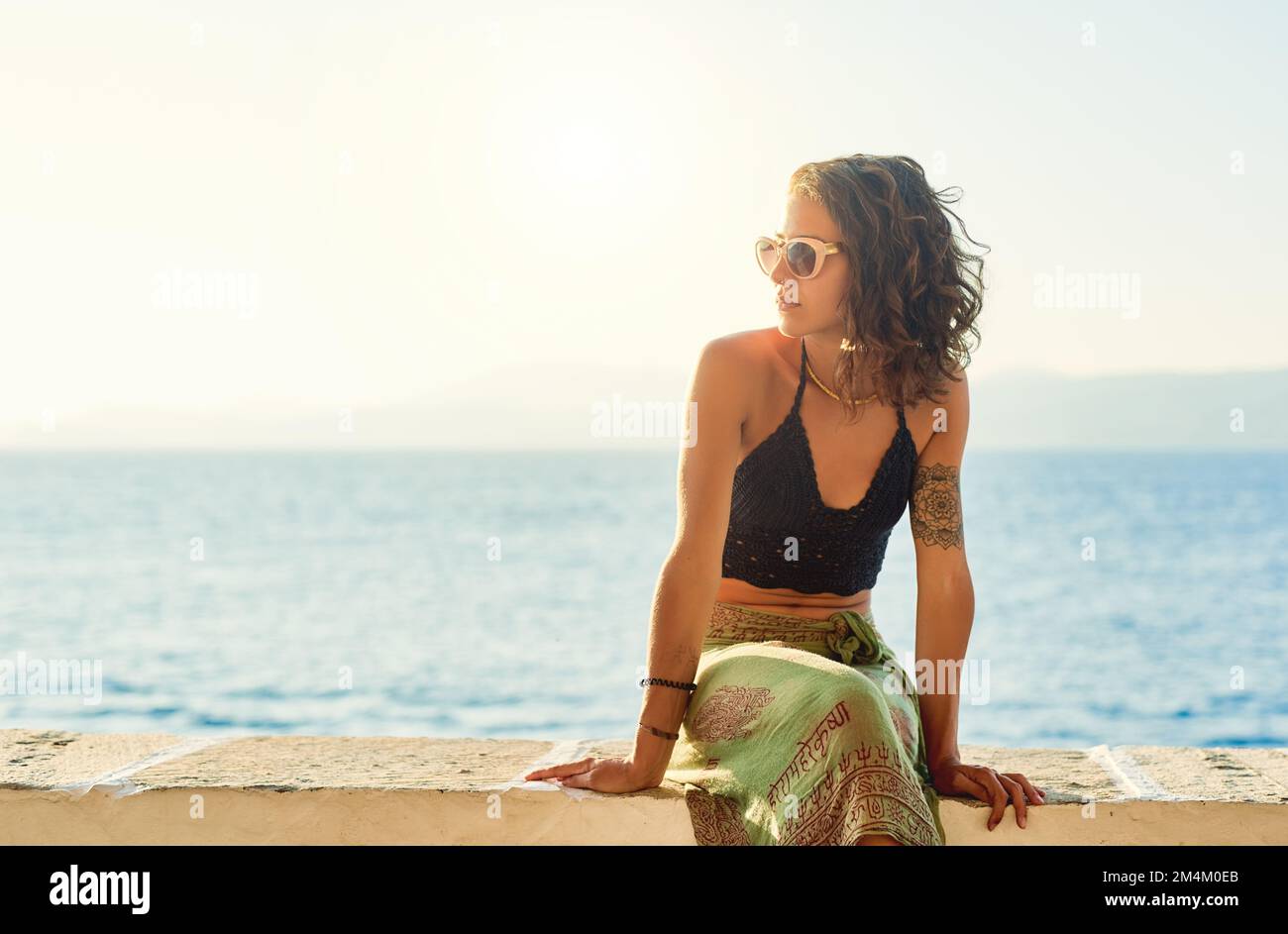 Enjoying the spectacular views. a beautiful young woman outside Stock ...
