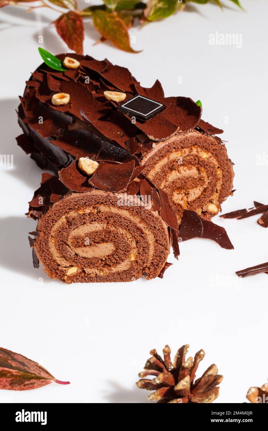 Sliced chocolate cake roll with buttercream and hazelnuts Stock Photo ...