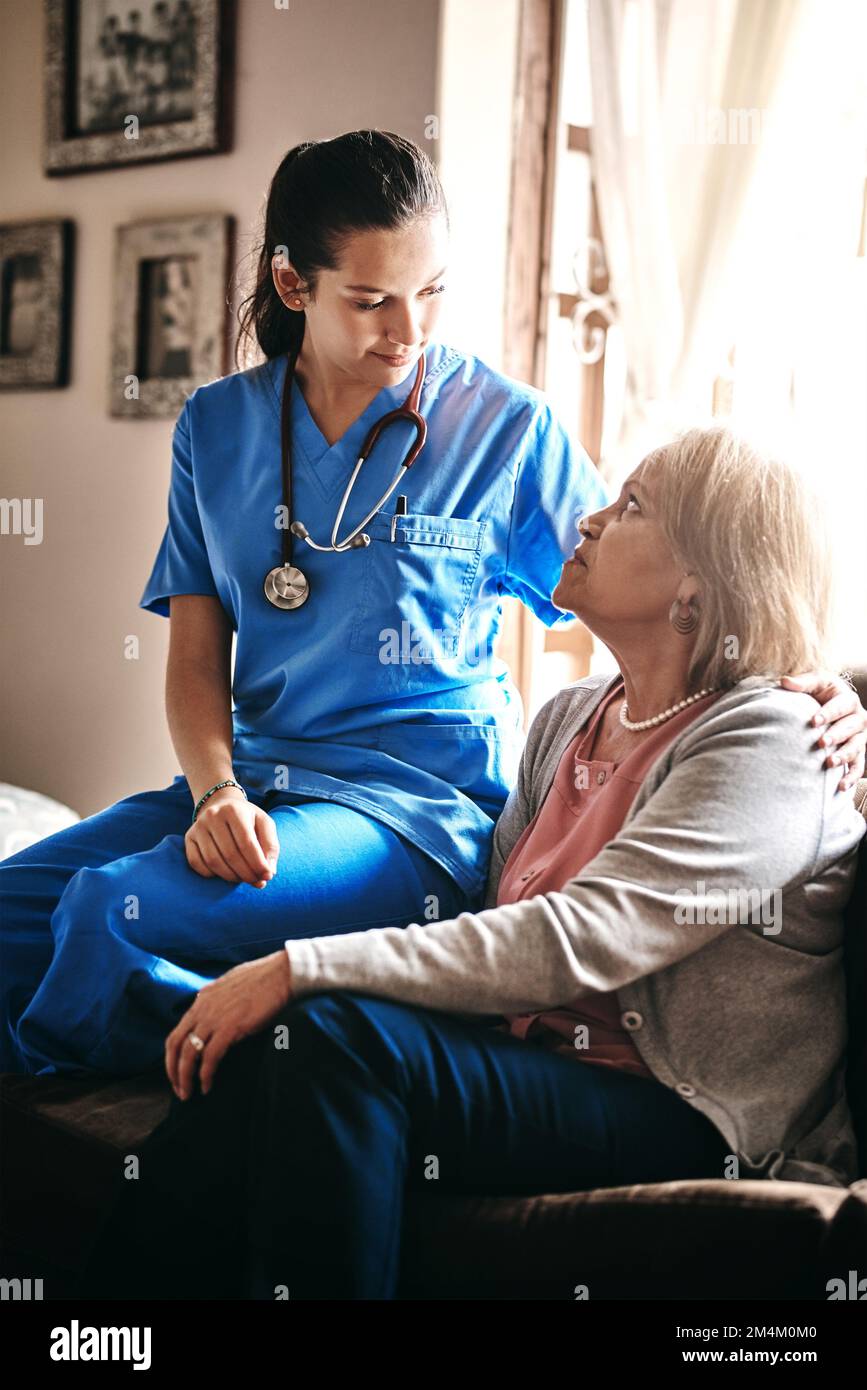 Young nurse and old nurse chatting hi-res stock photography and images ...